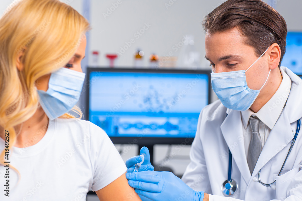 Professional doctor makes a coronavirus vaccine using a syringe and ...