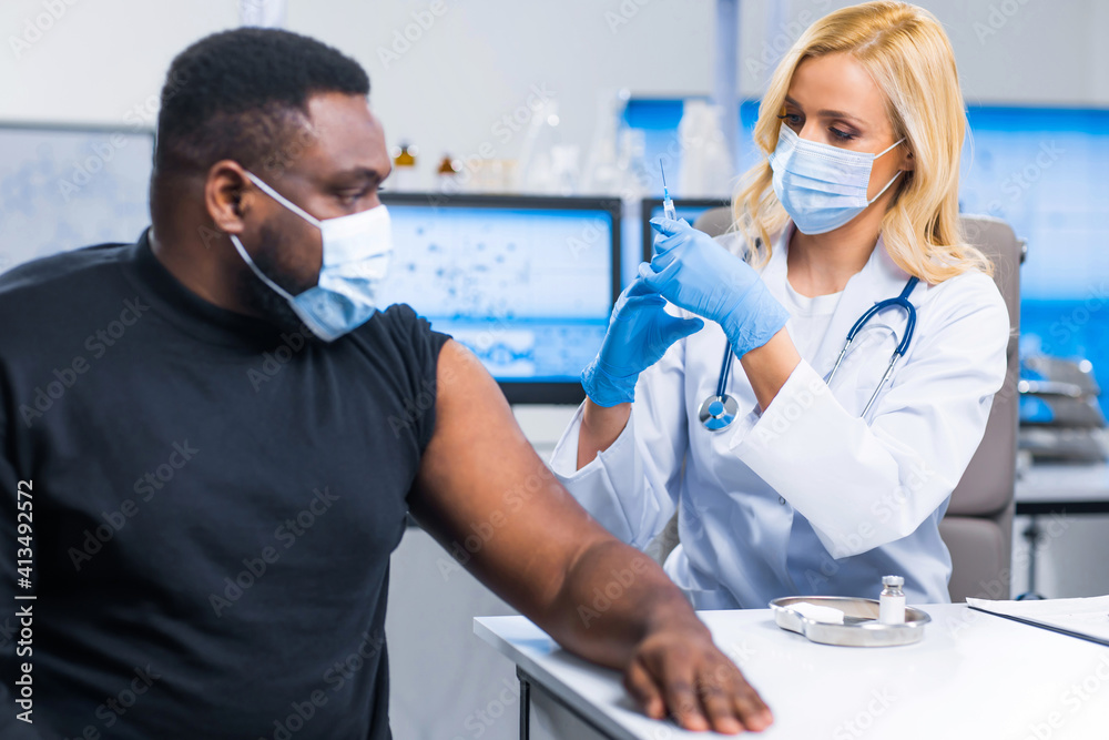 Professional doctor makes a coronavirus vaccine using a syringe and ...