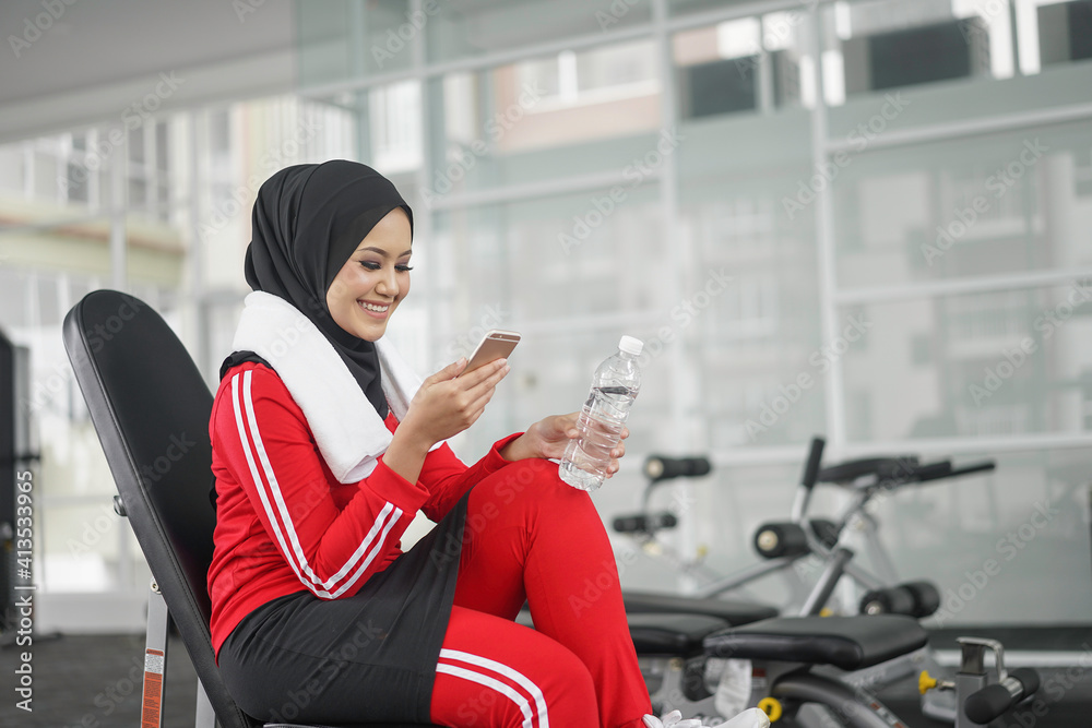 Portrait of attractive young Muslim woman workout in gym healthy ...