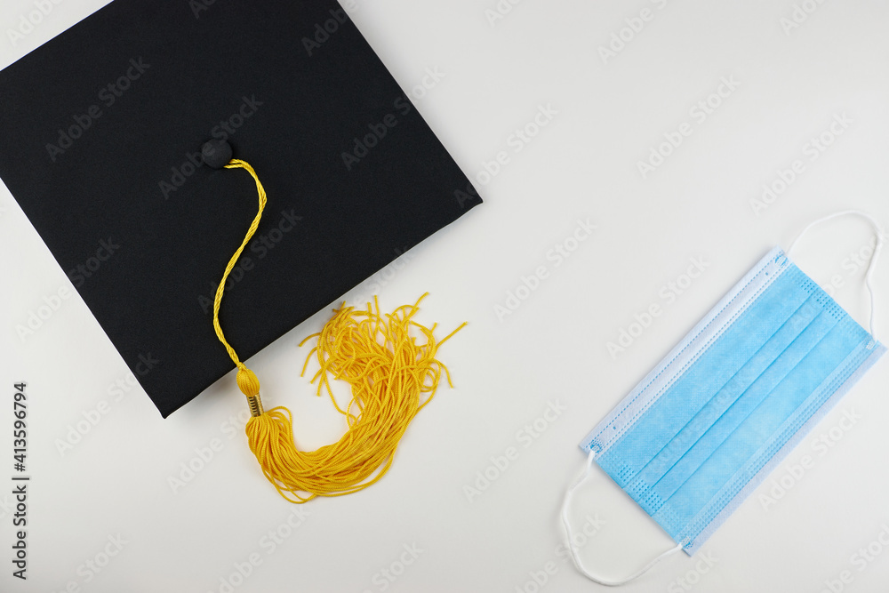 Graduation cap and medical mask on a white background. Proms in the ...