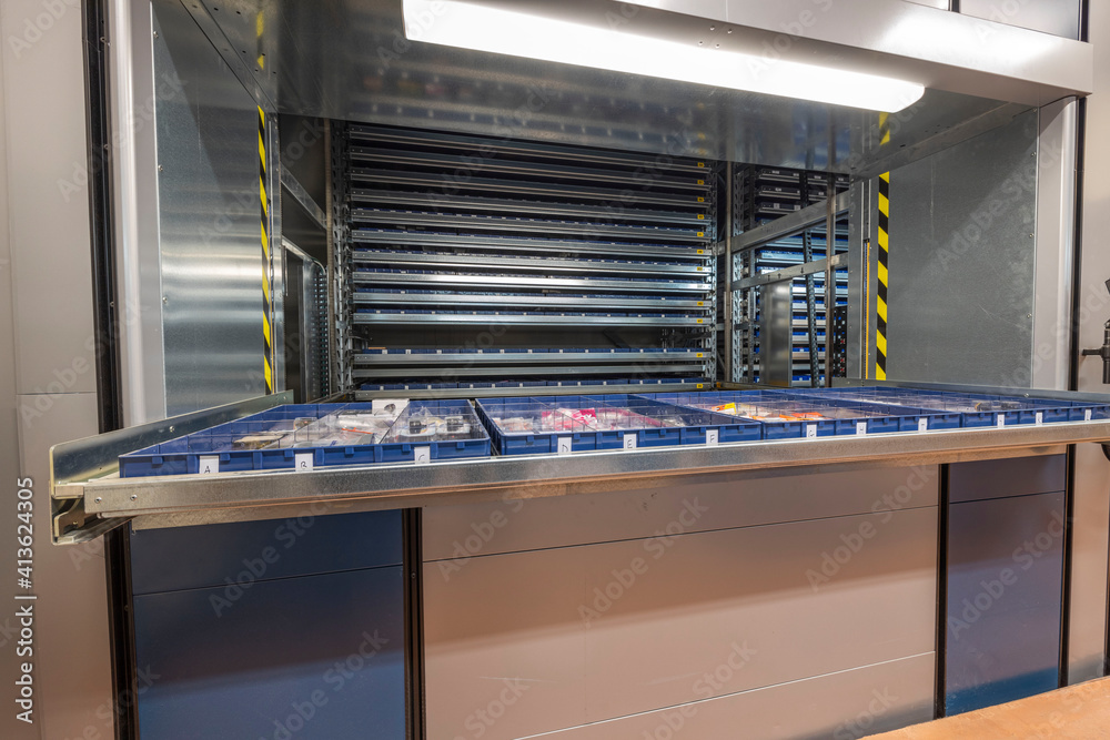 Automated storage system in the warehouse. Vertical carousel storage ...