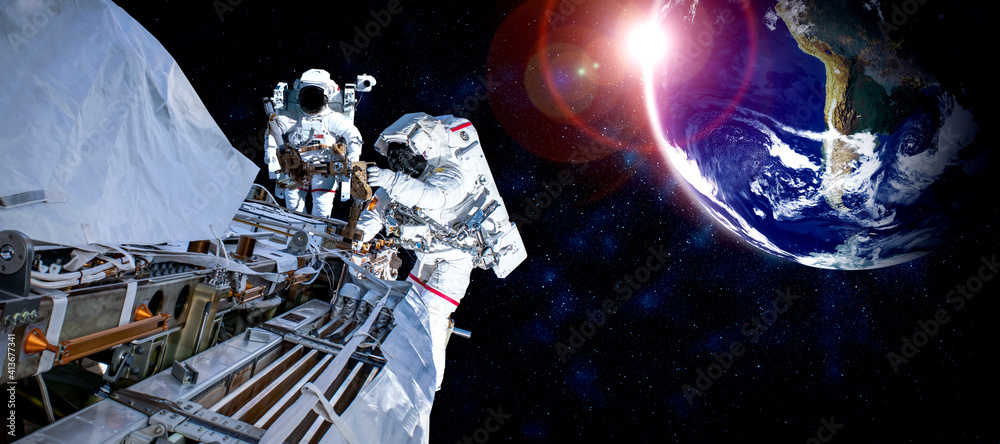 Astronaut spaceman do spacewalk while working for space station in ...