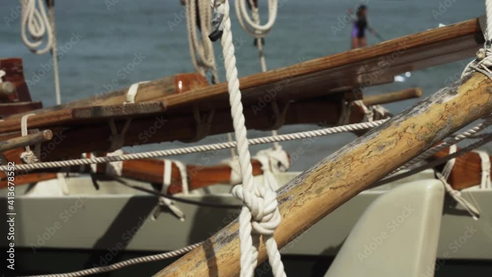 Catamaran Polynesian double-hulled ship deck rigging with winch and ...