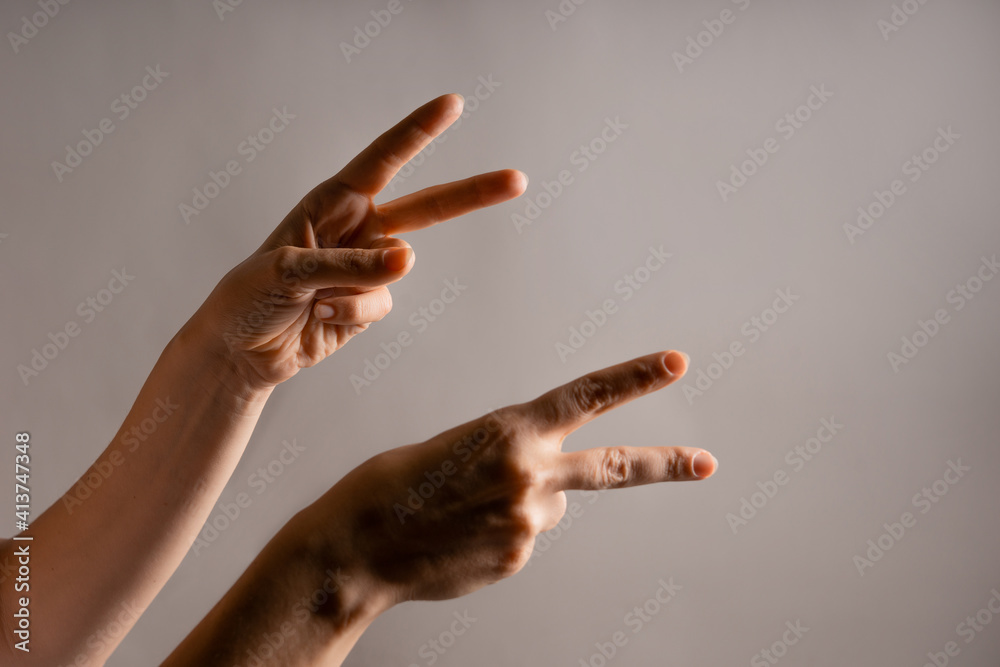 Two thumbs up, a victory gesture. Women's hand . Hand gestures Stock ...