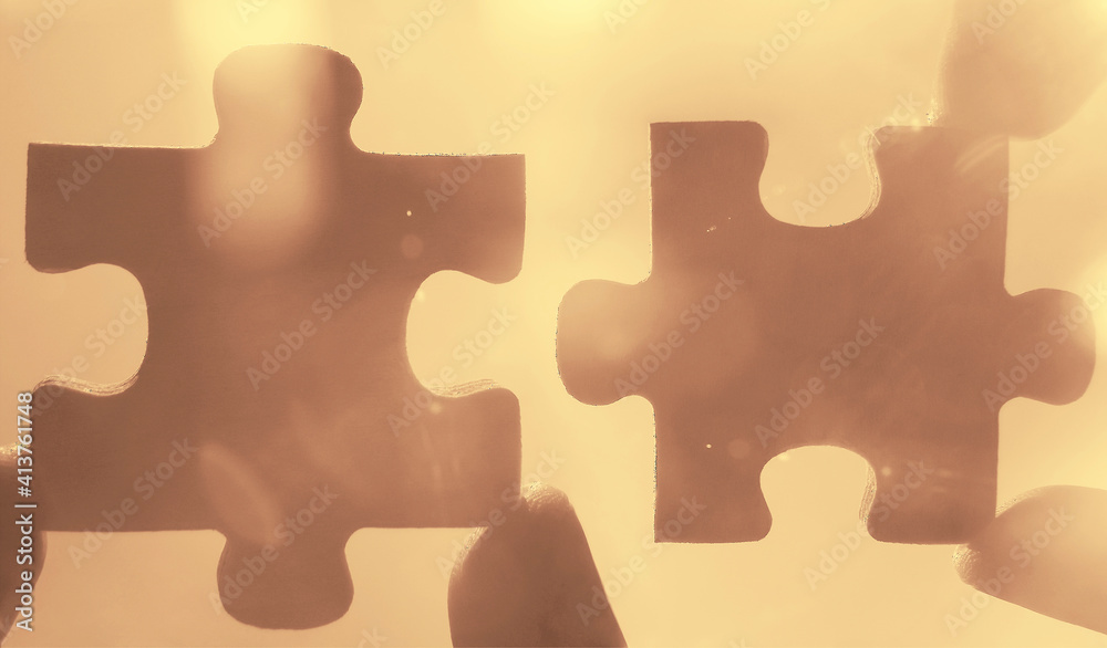 2 two fingers trying to connect puzzle piece. sunny sky background ...