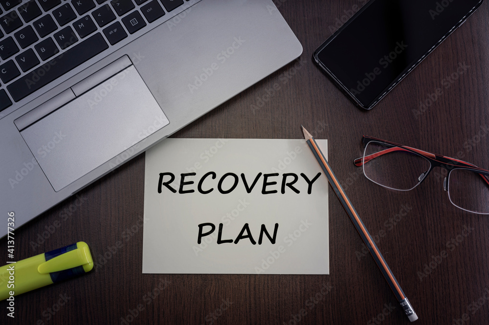 Recovery plan card. Top view of office table desktop background with ...