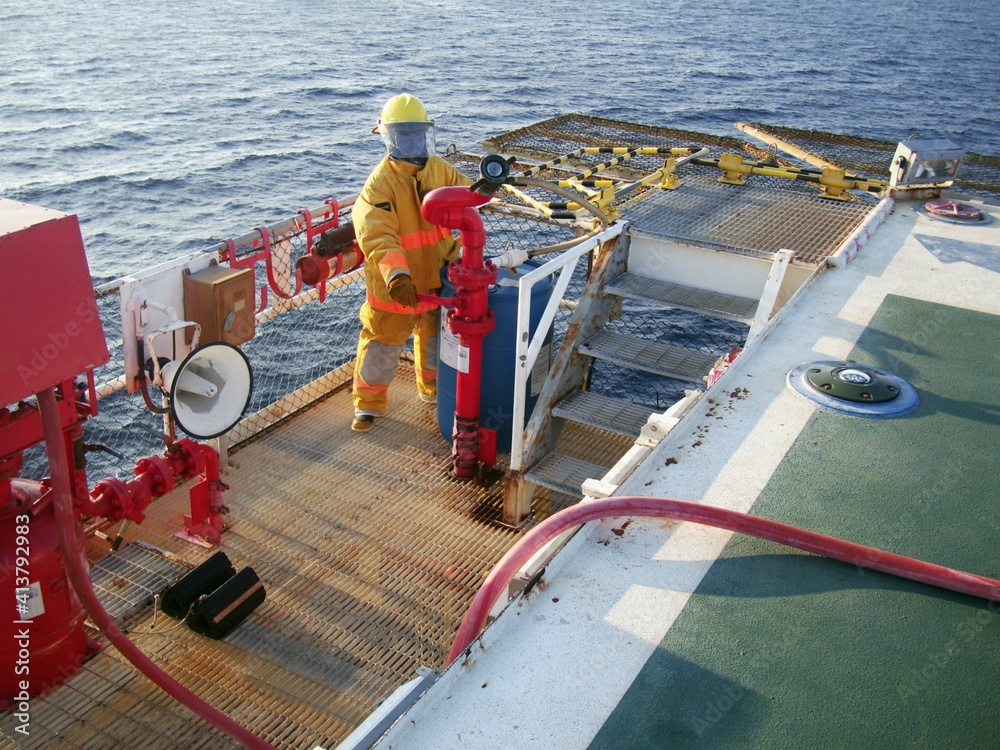 Fire drill training on board for the crew in ship on offshore plant ...