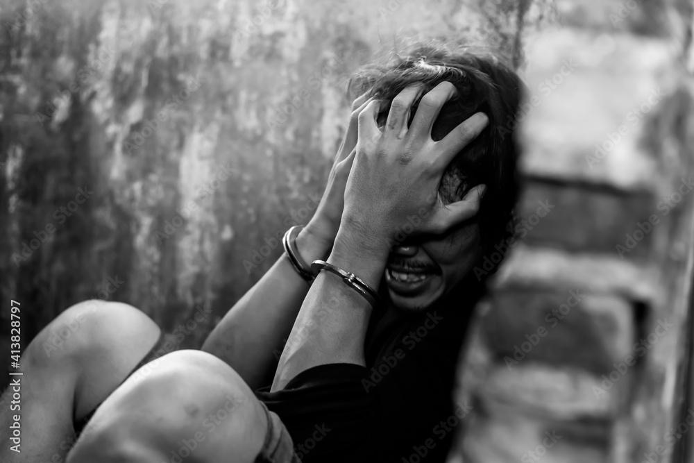 Mad guy was cuffed and under arrest by policeman and detain prisoner in ...