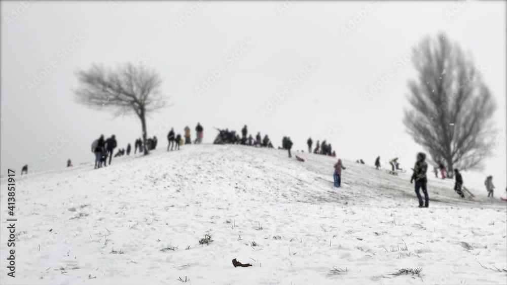 De-focused view. Crowd of people having fun In cold winter day and ...