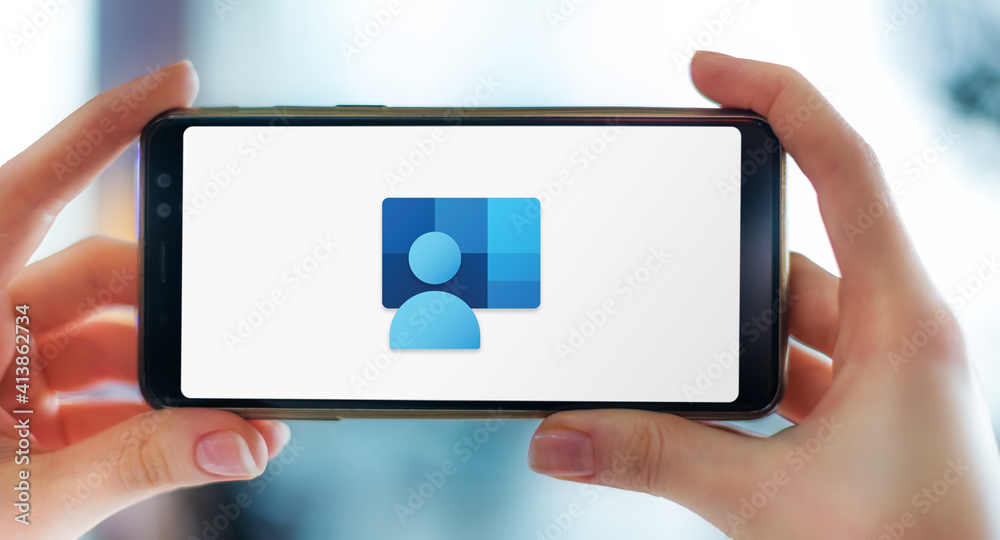 Hands holding smartphone displaying logo of Microsoft Intune foto de ...
