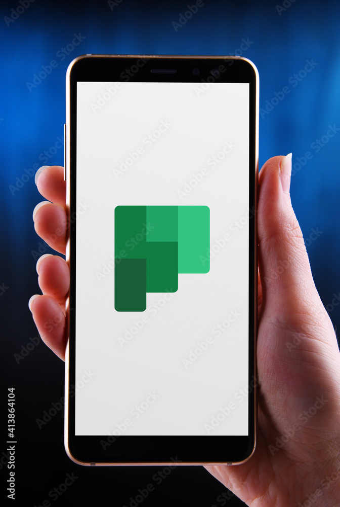 Hand Holding Smartphone Displaying Logo Of Microsoft Planner Stock hand-holding-smartphone-displaying-logo-of-microsoft-planner-stock