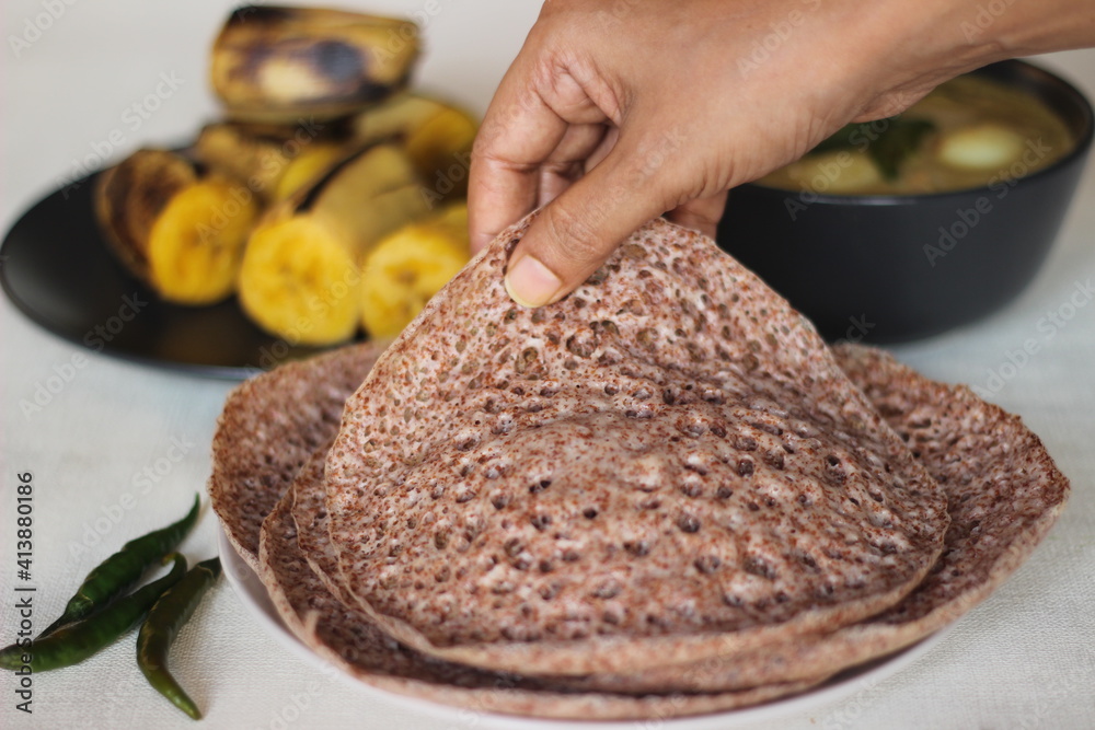 Hoppers made of finger millet served with egg stew prepared in Kerala ...