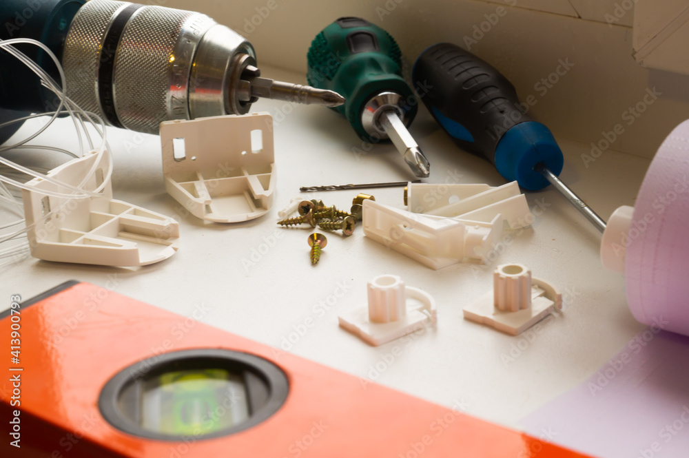 Installation of a window roller with a holder. Installation tool. Stock ...