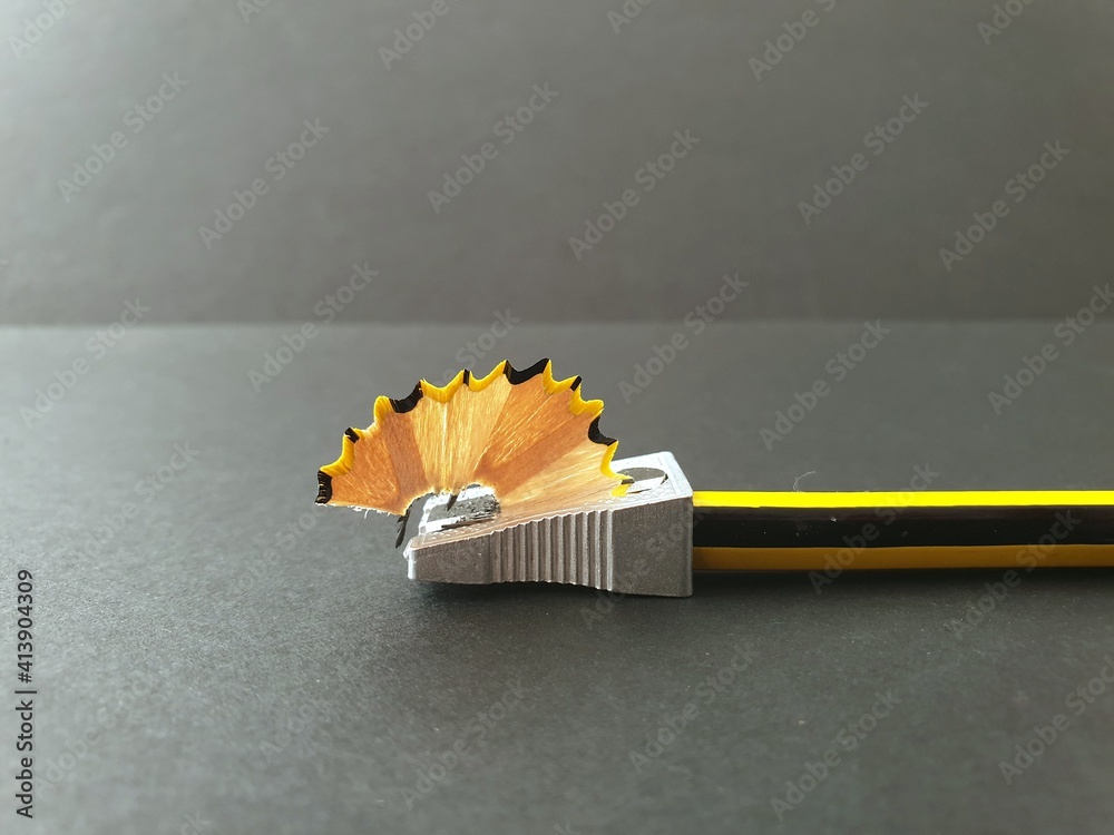 Pencil sharpener starting to sharpen. Concept of starting, beginning ...