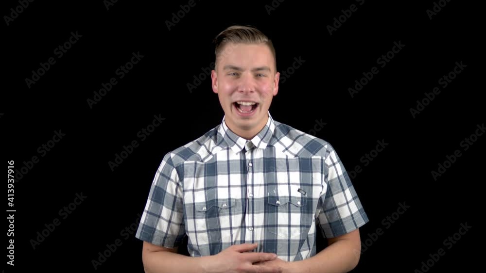 The young man shows the emotion of laughter. A man is laughing in a ...