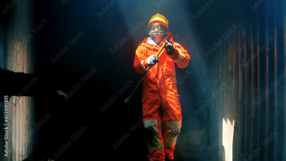Firefighter fighting with flame using fire hose chemical water foam ...