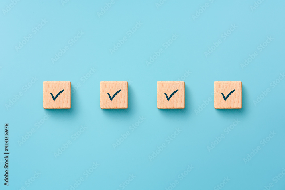 Check mark on wooden blocks, blue background, Checklist concept Stock ...