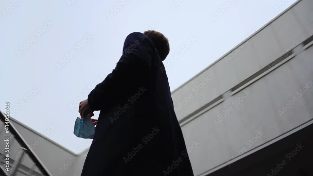 Sad Young Man Taking Medical Mask Off His Face Under Snowfall. Lonely ...