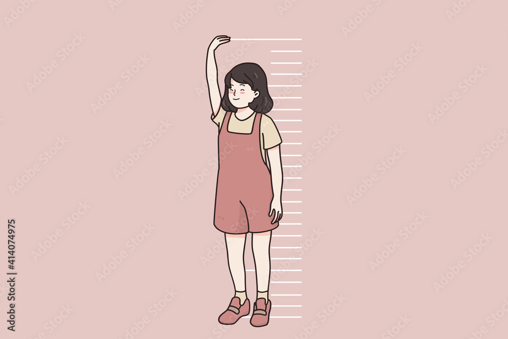 Children growing, height of body concept. Smiling little girl child ...