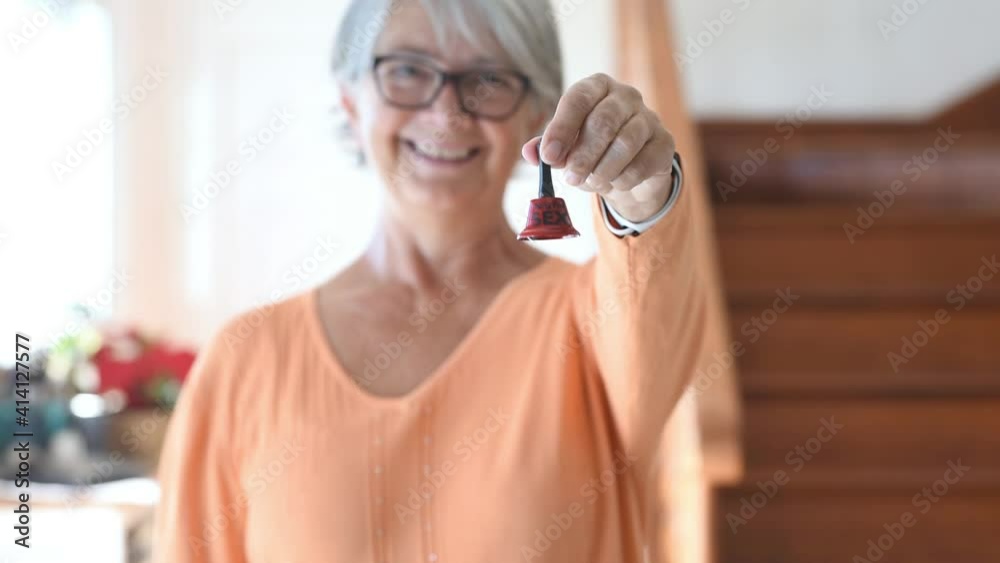 Old and mature woman and ringing a red bell asking and calling sex ...