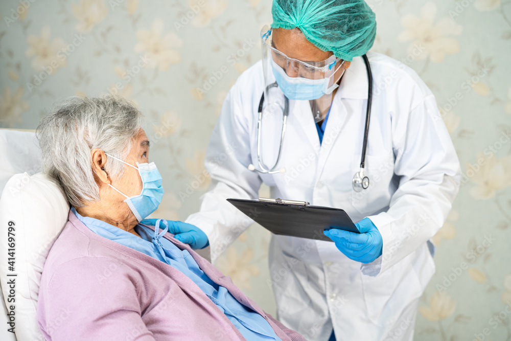 Asian doctor wearing face shield and PPE suit new normal to check ...