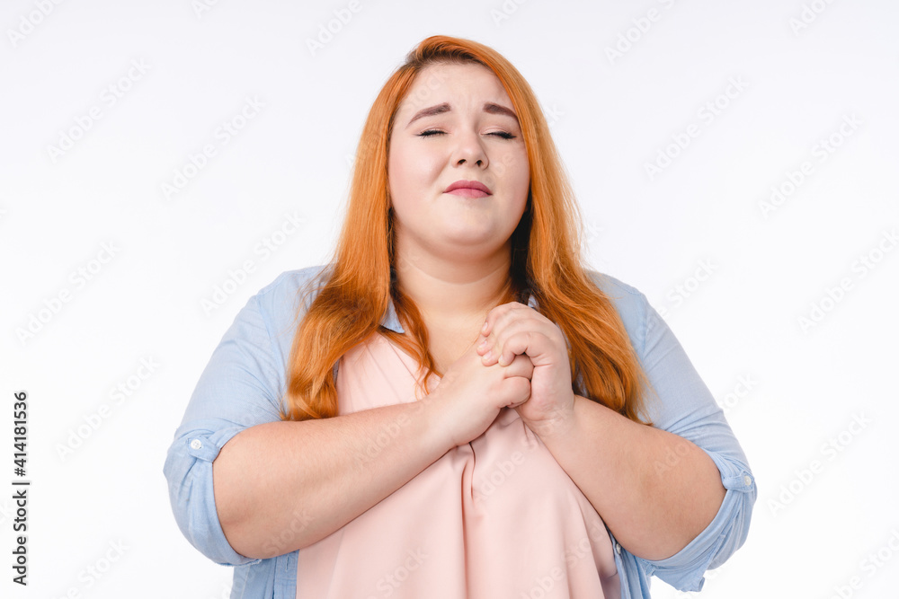 Fat ginger-haired woman touched by a compliment isolated in white ...