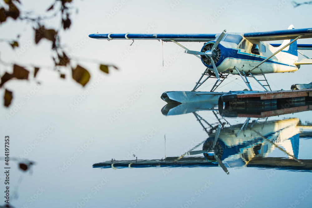 Beautiful reflection of a vintage float plane with fog in the ...