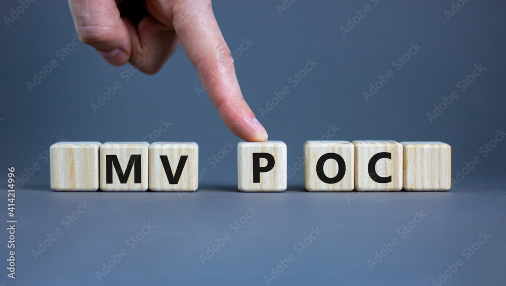 MVP vs POC symbol. Businessman pushes the cube with words MVP, minimum ...