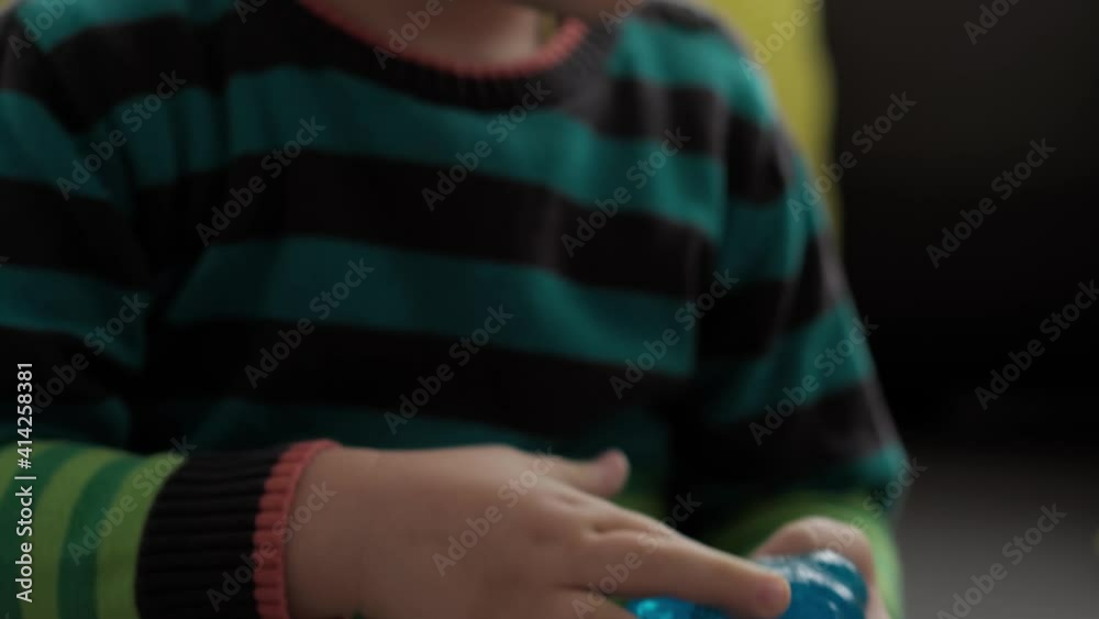Hands with blue and red slime close up. Girl and boy preschool minor ...