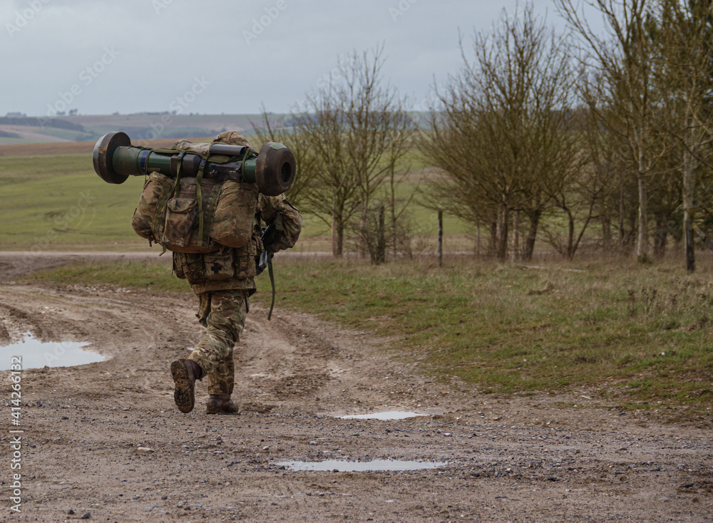 british army soldier completing an 8 mile tabbing exercise with fully ...