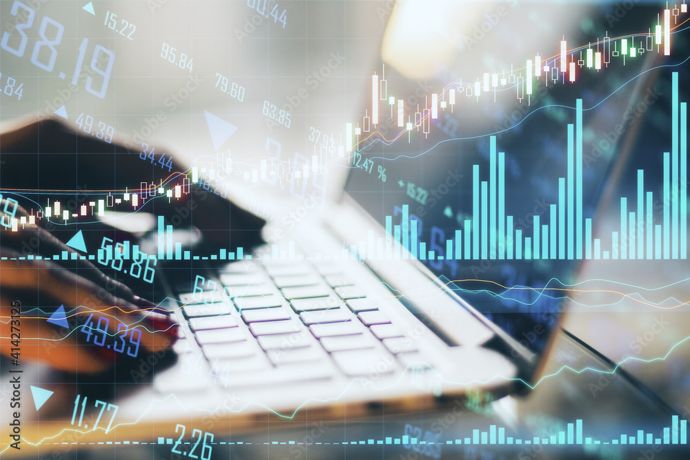 Online trading with hands typing on laptop keyboard and digital screen ...