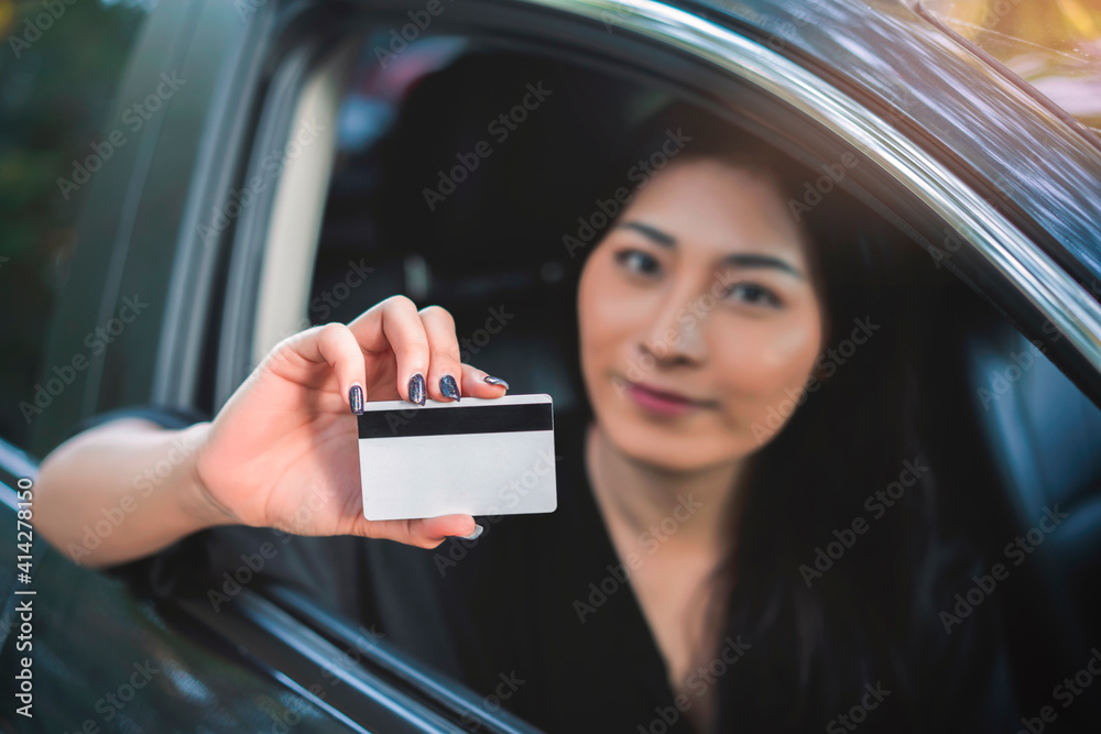 Asian woman holding driving license card identification driving car ...