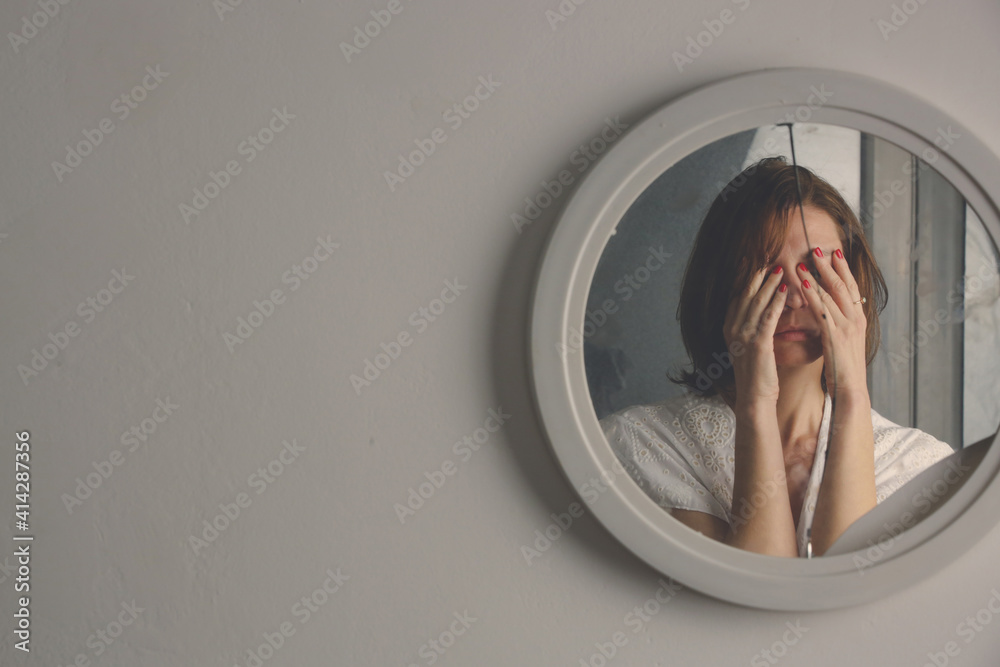 Reflection of a woman's face in broken mirror. Depression, anxiety ...