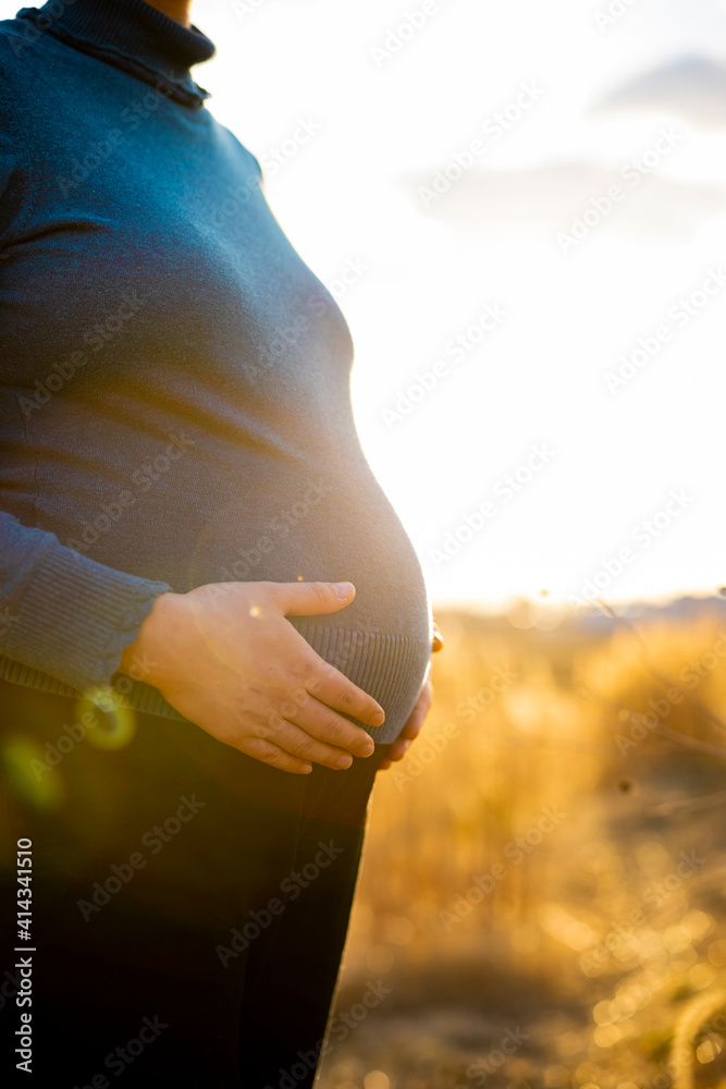A Japanese woman who is pregnant and close to giving birth. Outside in ...