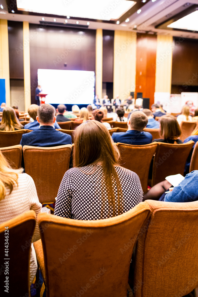 Professional Host Speaking In Front of the White Screen on Stage for ...