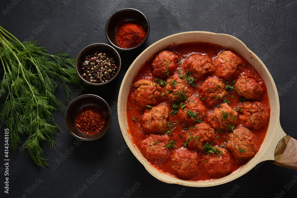 Boulettes de Poisson, Fried Fish Balls in Tomato Sauce in a white dish ...