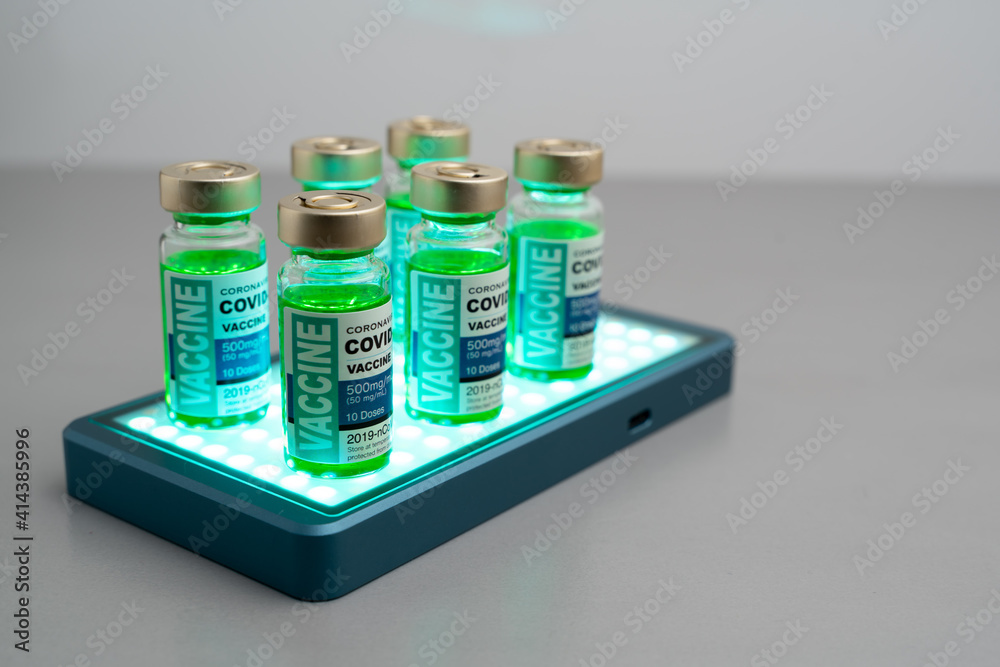 ampoules or vials with Covid-19 vaccine on a laboratory bench. SARS-CoV ...