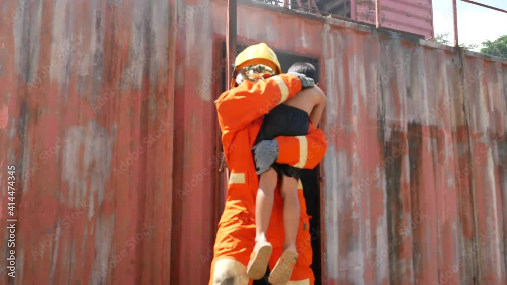 Firefighter fighting with fire flame protection property. Fireman wear ...