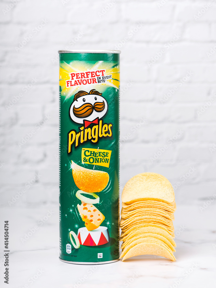 Pringles cheese and onion.Cardboard tube can with Pringles potato chips ...