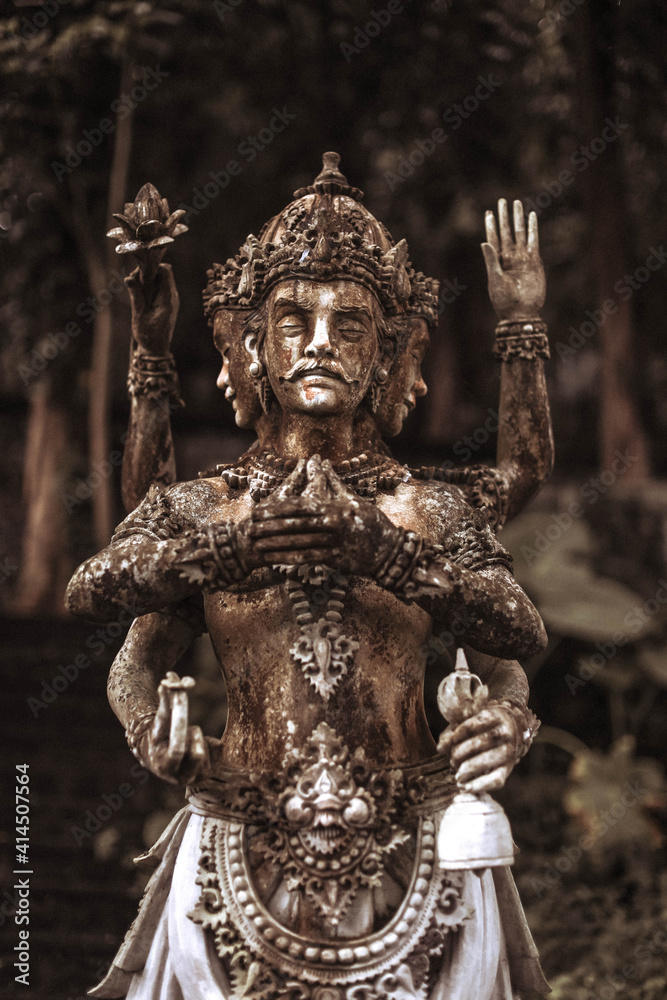 Statues of guardian god temple in Bali. Brahma Vihara Arama with ...