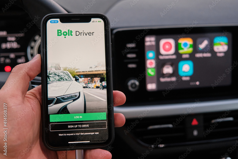 Bolt Driver on the screen of smart phone in mans hand on the background ...