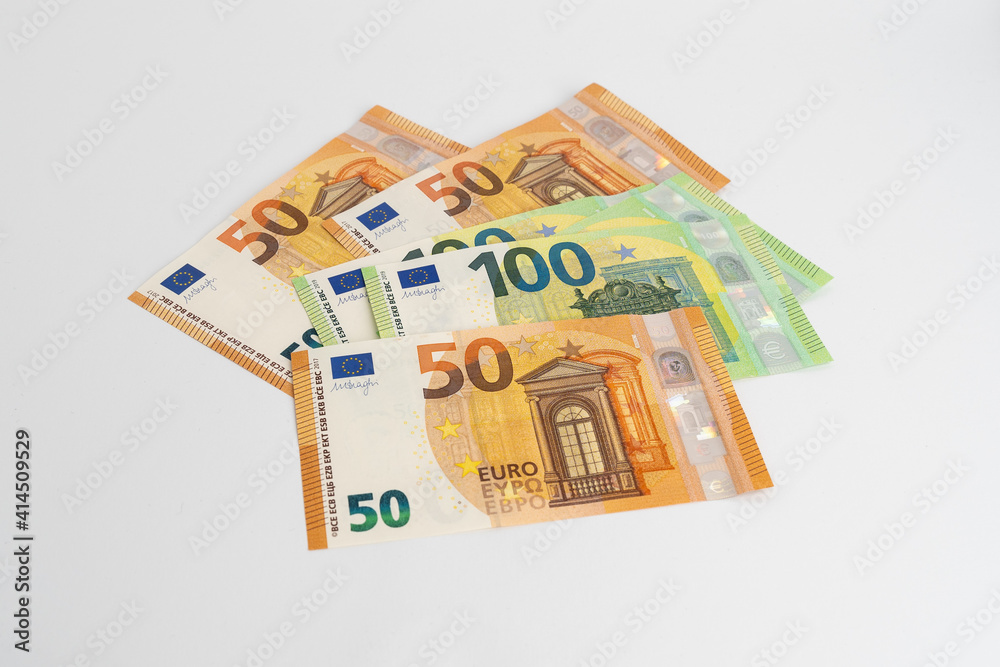 Banknotes on white background. Fifty and one hundred Euro notes in ...