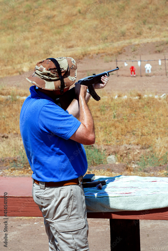 Target shooting with a semi automatic rifle Stock Photo | Adobe Stock