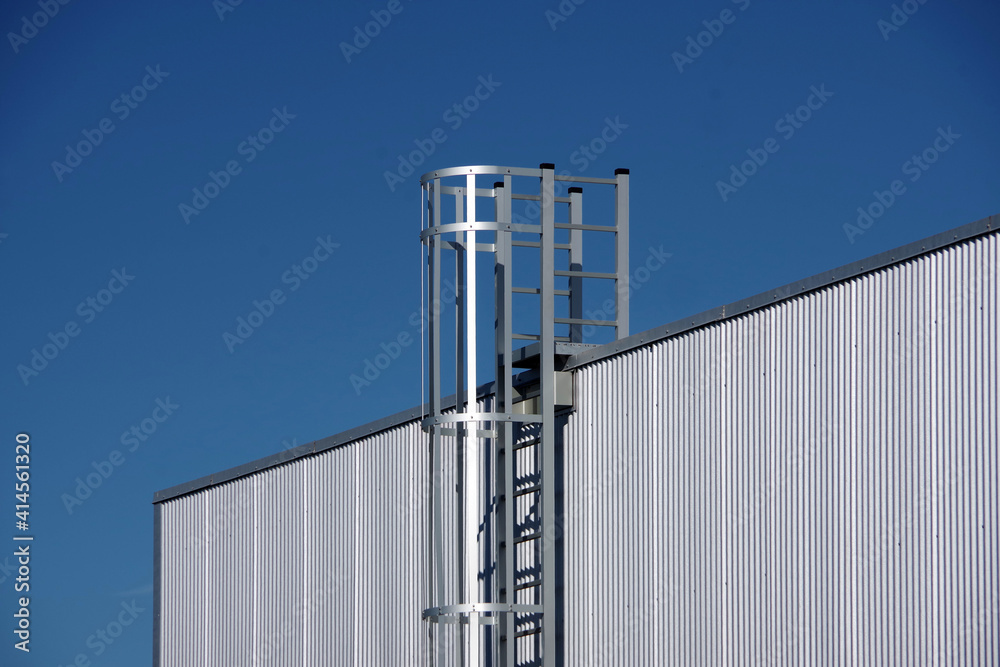Segment of an industrial warehouse building with corrugated metal ...