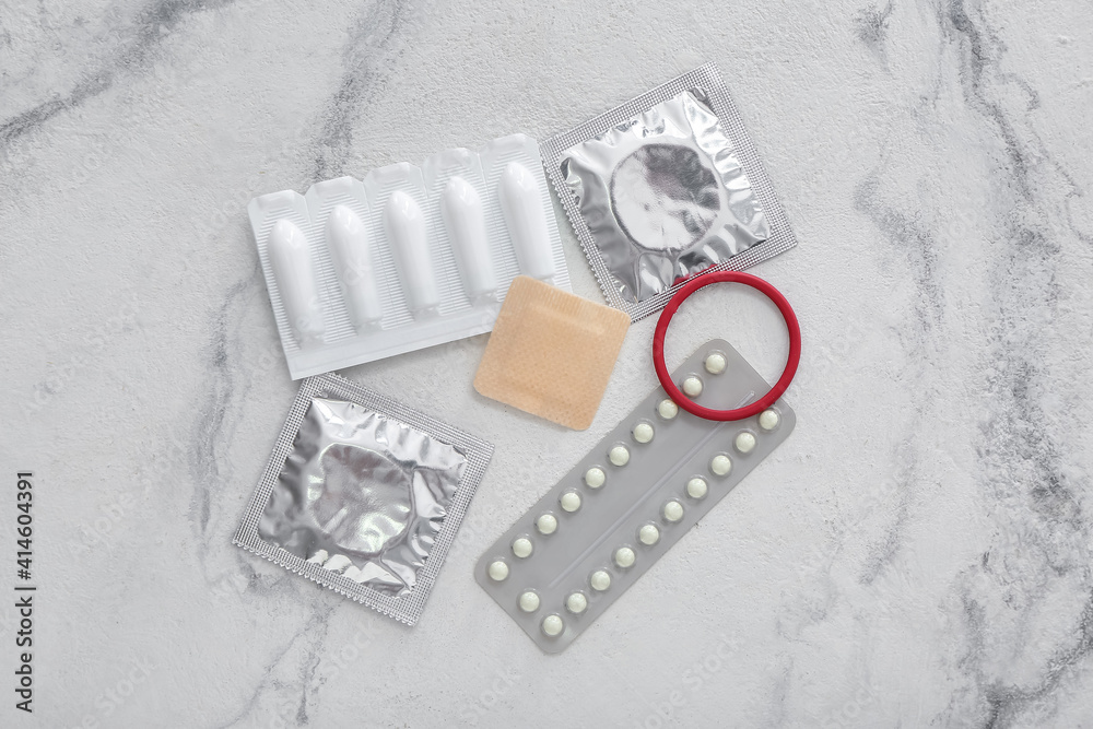 Different contraceptives on light background Stock 写真 | Adobe Stock