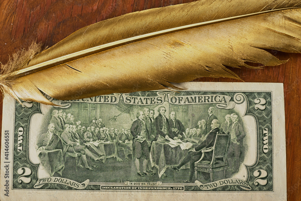 Gold quill pen and picture of signing US Declaration of independence in ...