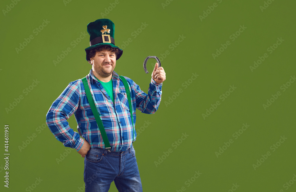 Smiling overweight man in checkered shirt and traditional hat standing ...
