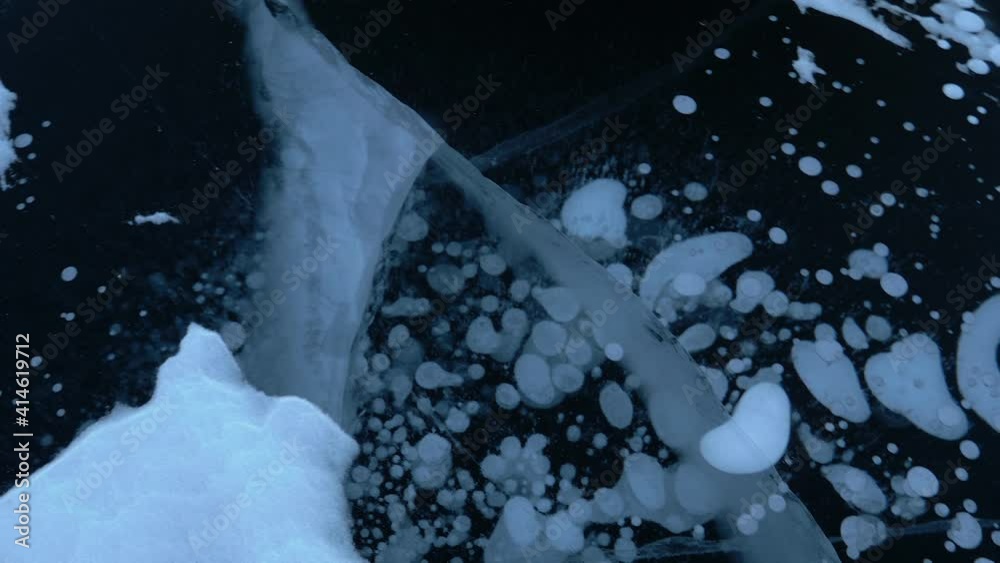 Methane bubbles frozen in Arctic lake surface ice - natural biological ...