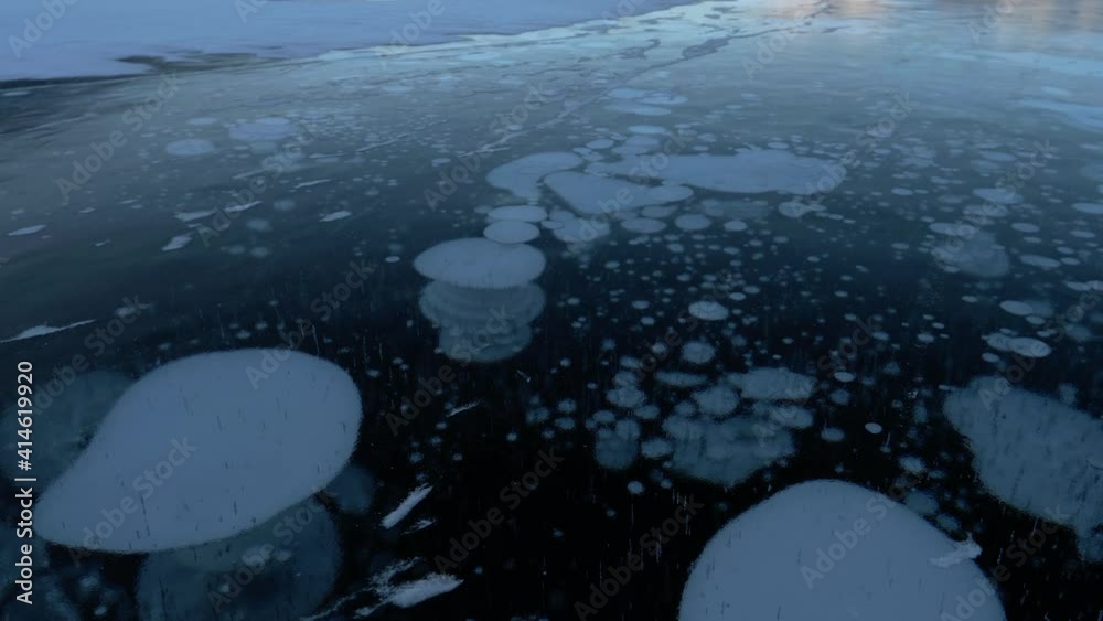 Methane Bubbles Frozen In Surface Of Arctic Circle Lake Ice - Tilt Up ...