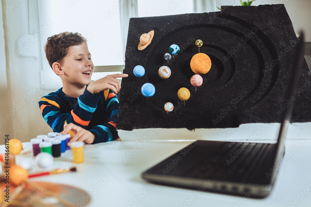 Kid presenting his science home project - the planets of our solar ...